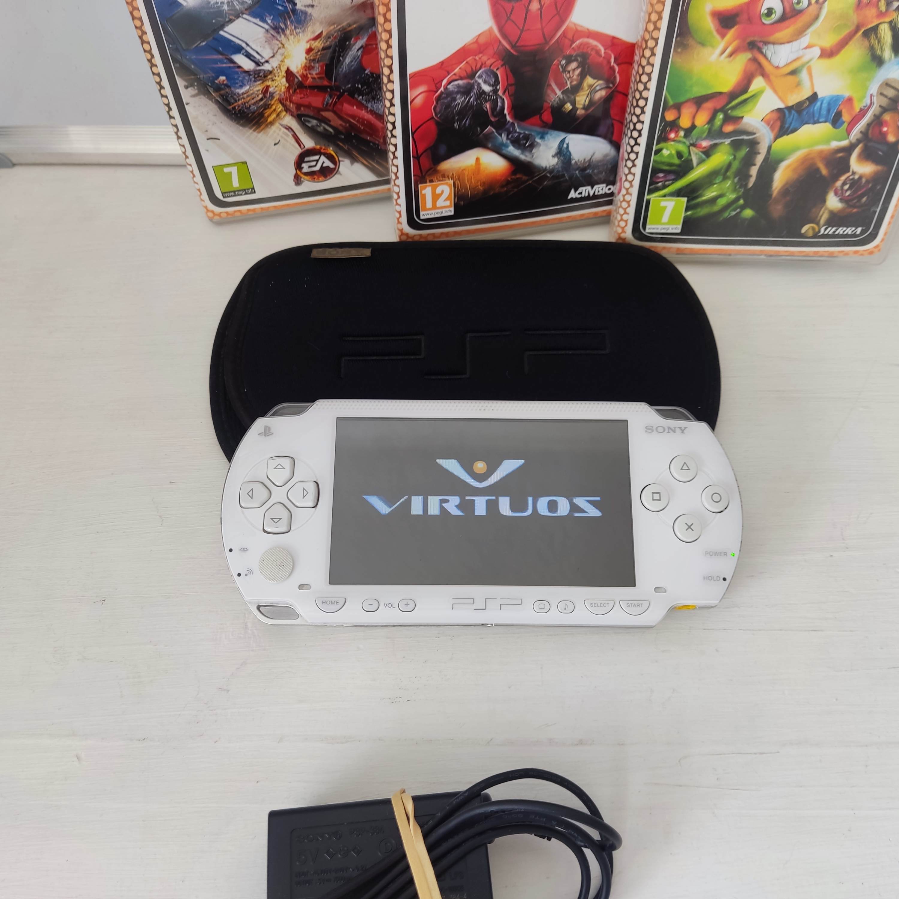 PlayStation - Psp console and games Sony model Psp 1003 for sale in ...